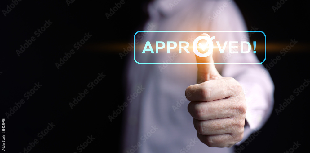 Approve concept. A man gives a thumbs up with a virtual approved sign ...
