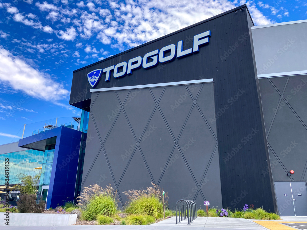 Topgolf sign, logo on the building facade of sport entertainment venue ...