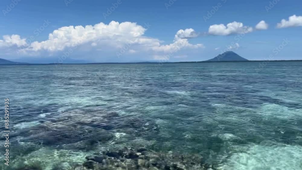 Clear ocean water and Manado Tua Mountain in the bunaken ocean. Manado ...