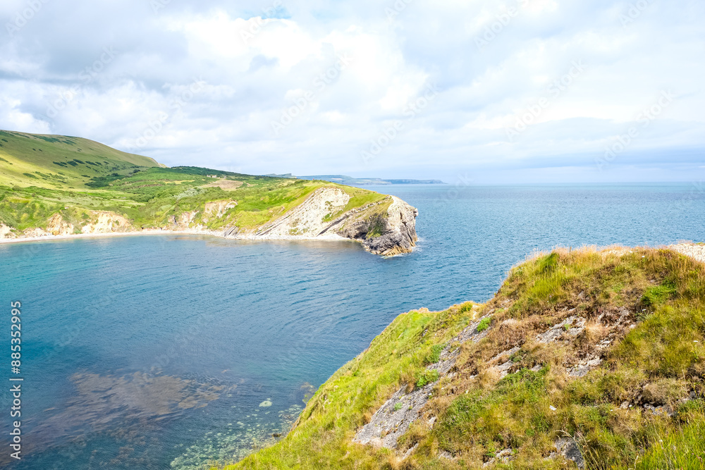 Lulworth Cove bay, beach and cliffs view . The Jurassic Coast is a ...