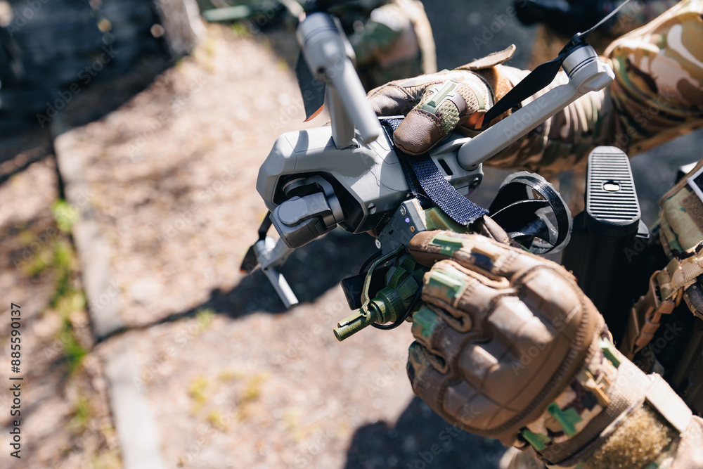 Soldier hold Military drone with bomb for attack to positions enemy ...