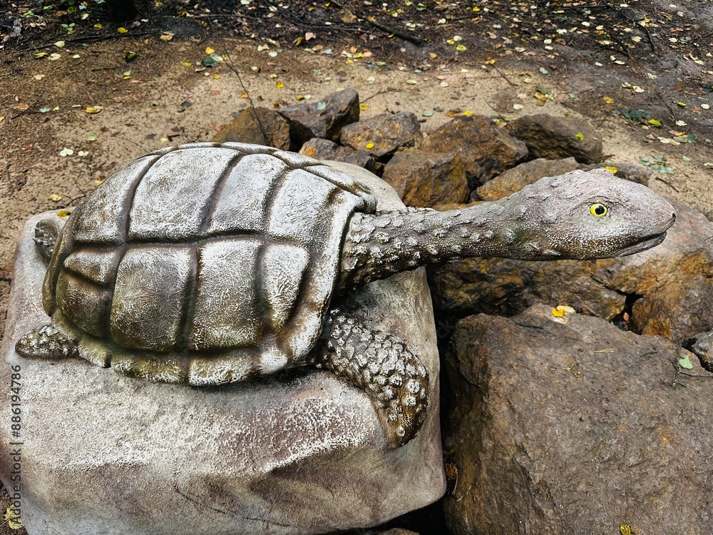 Realistic figure of an Turtle dinosaur inforest park in Kazimierz ...