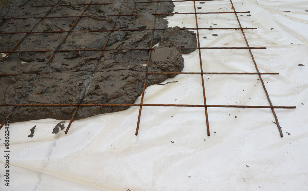 Close up on welded wire fabric in concrete floor slab. Reinforcing bar ...