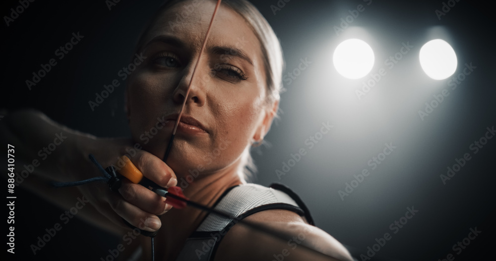 Close-Up Portrait Of Professional Female Archer in Action. Portrait of ...