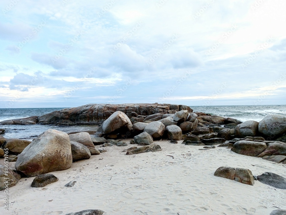 Cluster of Black Stones Clump and Beach Sand at front of Ocean and ...