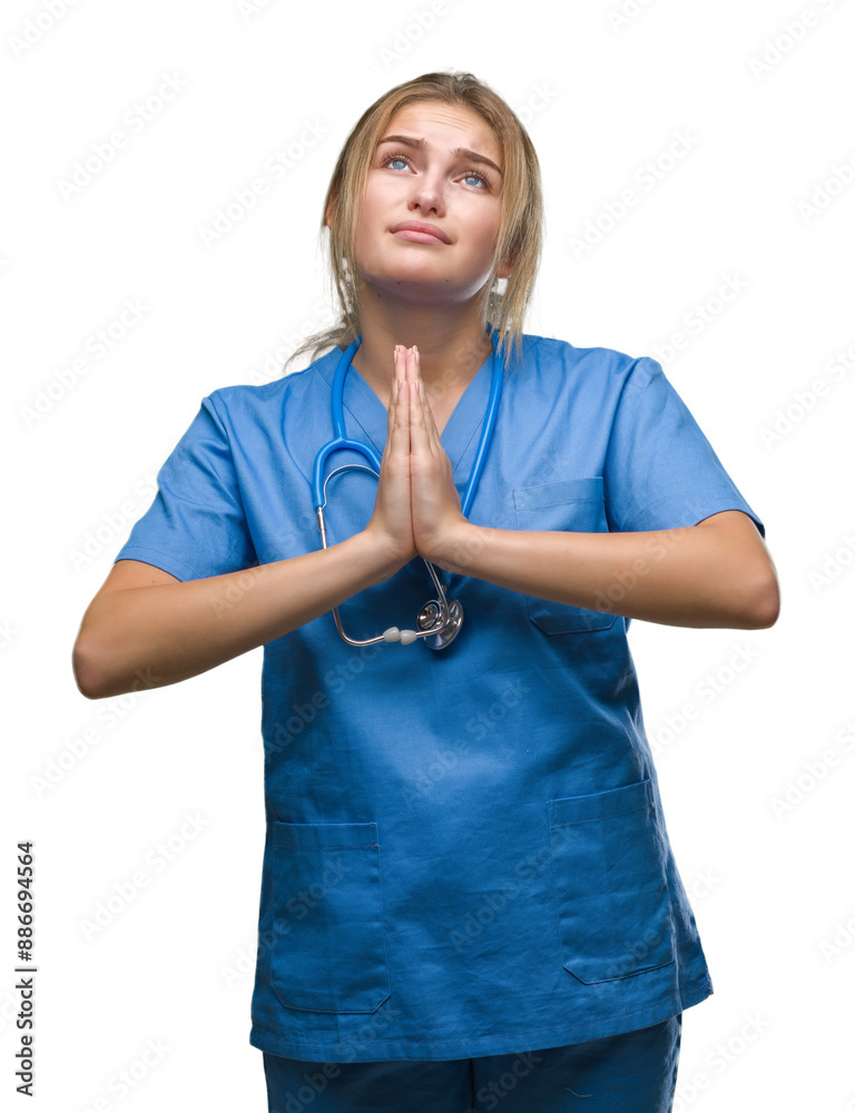 Young caucasian doctor woman wearing surgeon uniform over isolated ...