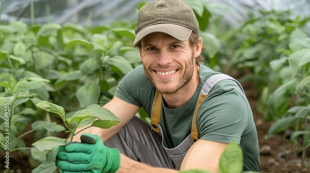 Gardener smiling proudly while tending to plants in a beautiful garden ...