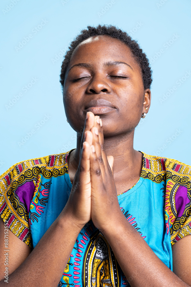 Confident serious person holding hands in a prayer to talk to God ...