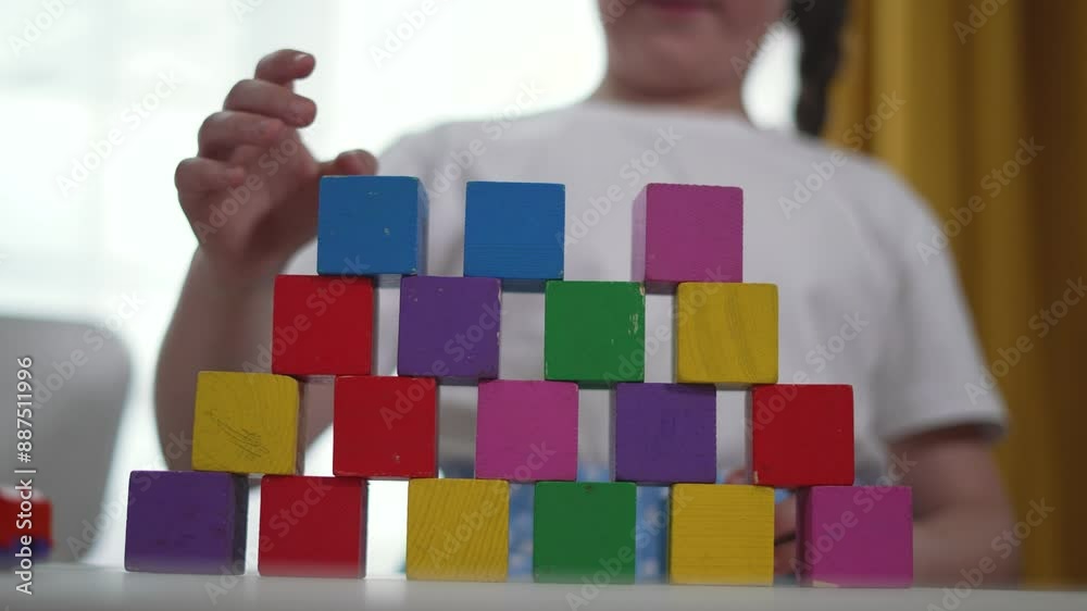 Children play with cubes build tower table. Developing builder skills ...
