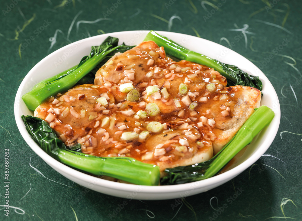 Hakka Fried Yong Tau Foo with green leaves served in dish isolated on ...