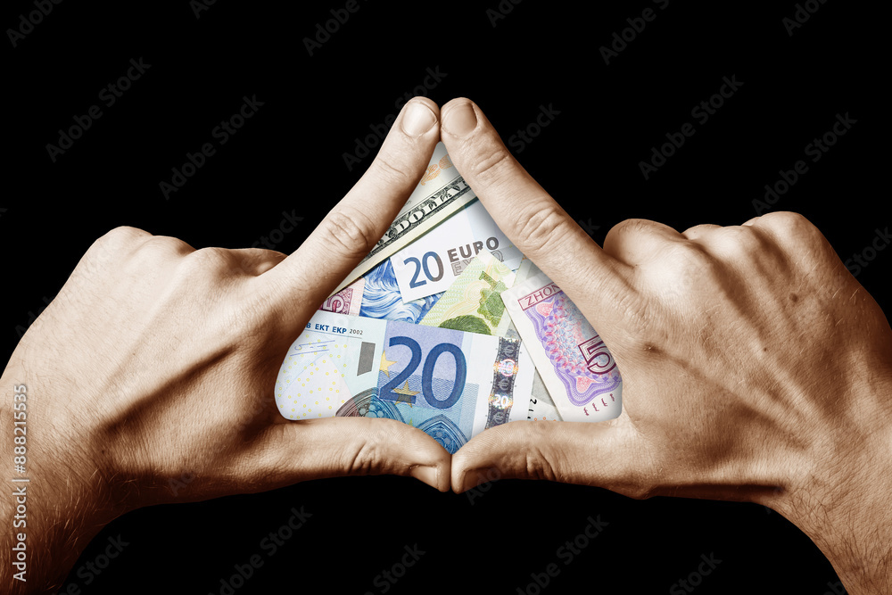 Conceptual image of money worship. Fingers arranged in a triangle with ...