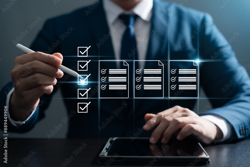 Business performance checklist and tracking, businessman using laptop ...