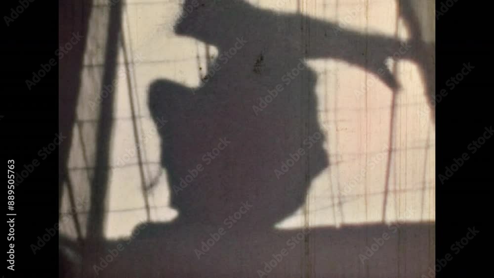 Enemy silhouette bent over opponent, fight ensued. Fighting between two ...