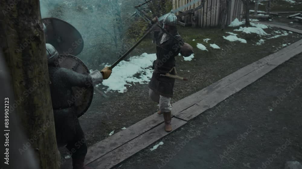 Full high-angle slowmo shot of medieval male warrior in helmet, with ...