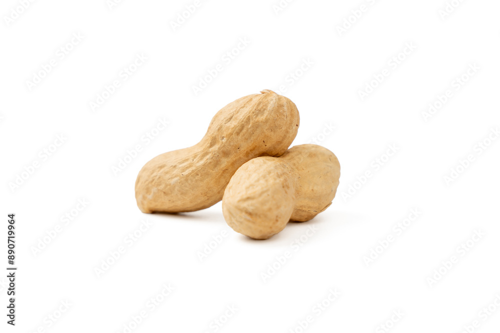 Two peanuts are sitting on a white background. The peanuts are ...