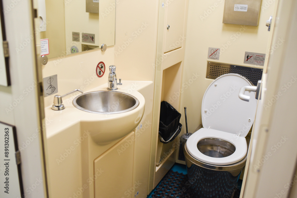 toilet room on a long-distance train. composting toilet, sink and ...