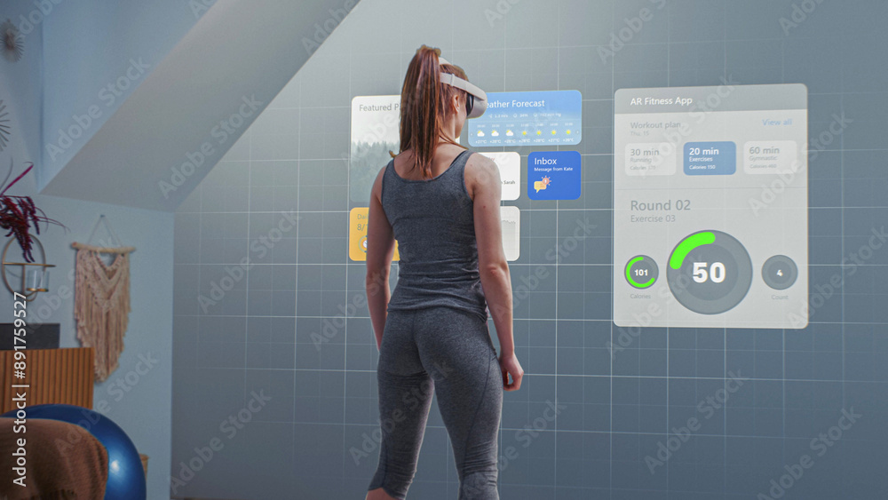 Athletic woman wearing VR headset starts online training. VR screen ...
