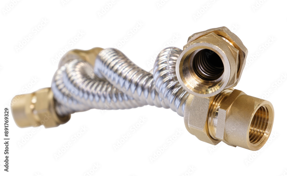 Corrugated stainless steel and brass flexible pipe is bent and twisted ...