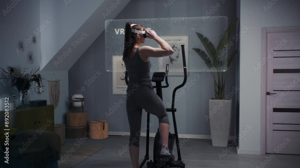 Female athlete wearing virtual reality headset starts training on ... Female athlete wearing virtual reality headset starts training on ...