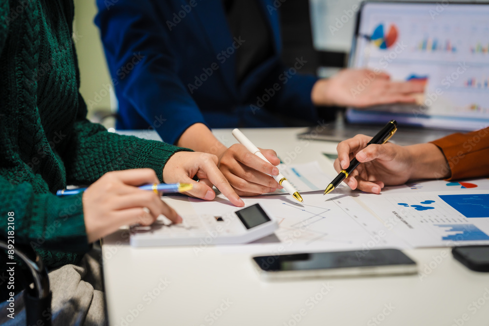Close-up of hands working on UX/UI design at a desk. Papers with ...