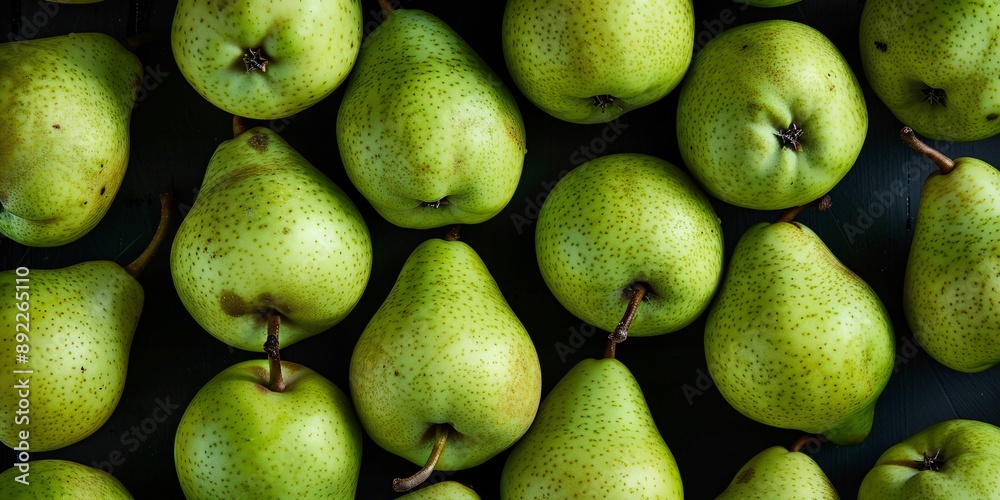 Numerous fresh green pears tightly packed, displaying a variety of ...