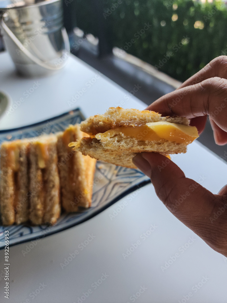 Man hand holding Kaya toasts butter. Kaya toasts butter and black ...