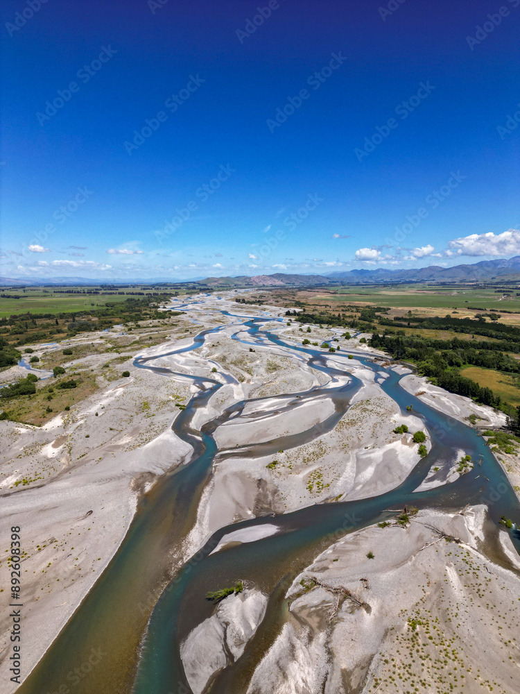 Aerial view of braided river formed from glacial melt and sediment ...