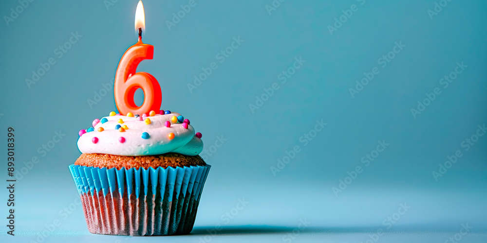 Cupcake to celebrate anniversary or birthday with orange candle in the ...