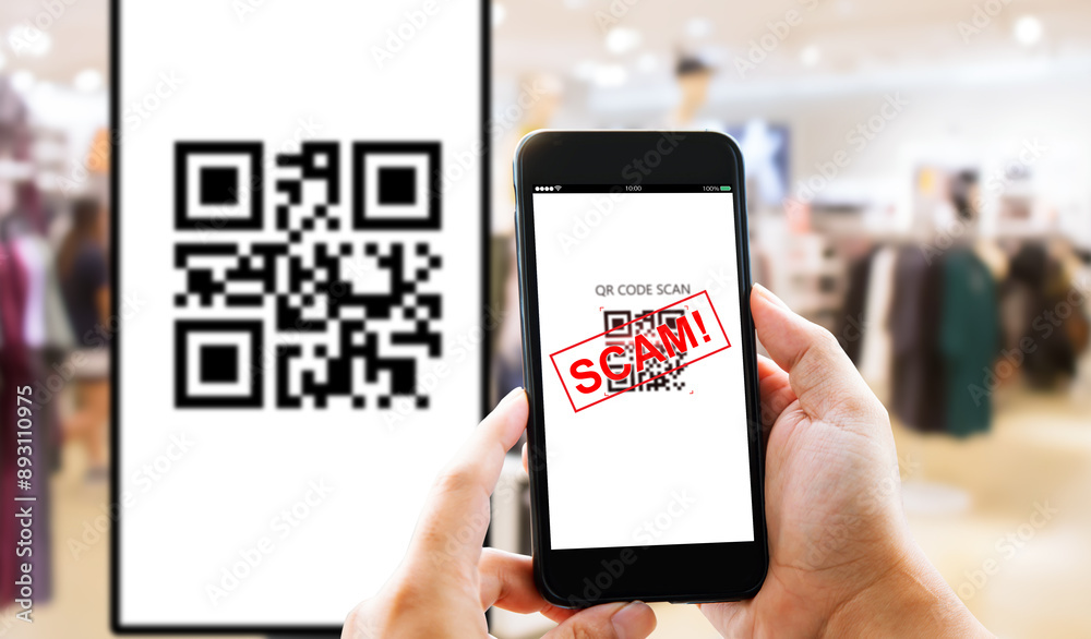 Fake QR Code scams fraud phishing concept. Man hands using smart phone ...