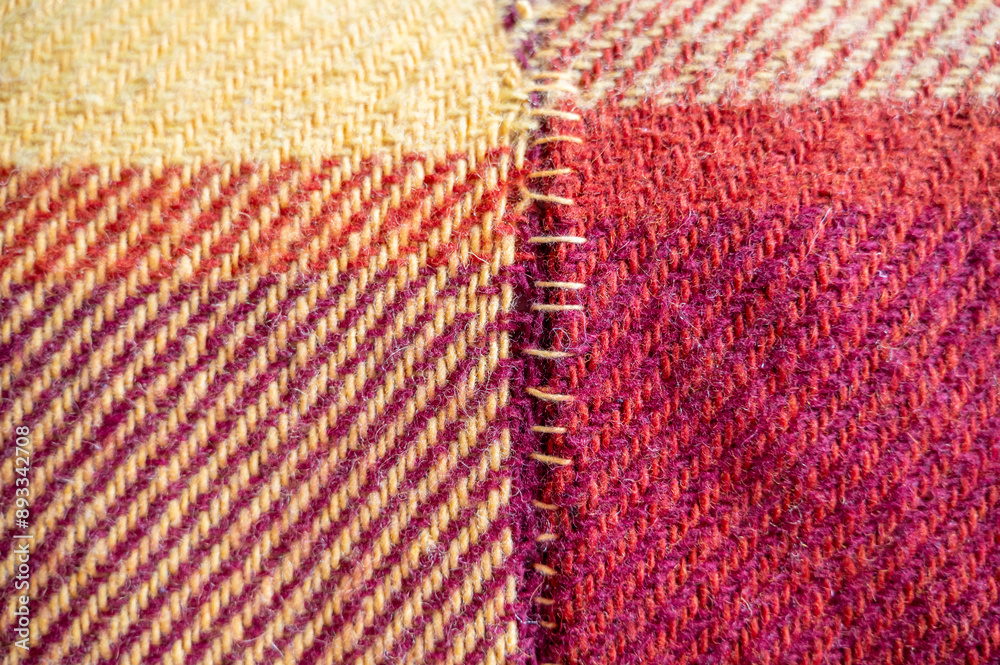 Old woolen blanket torn and mended with yellow thread. Concept of ...