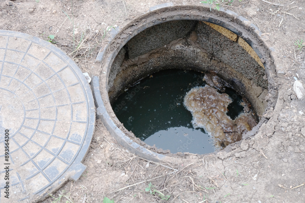 Overflowing septic tank of a country house, open hatch, top view Stock ...