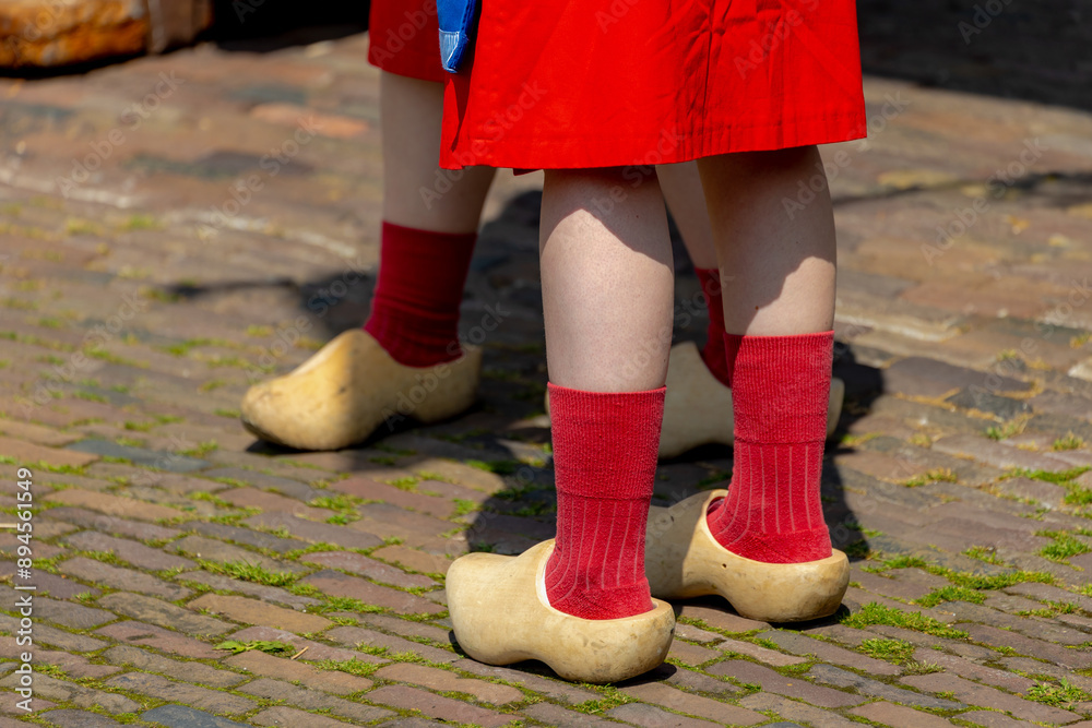 Selective focus low angle of women wearing wooden shoes (Clogs) with ...