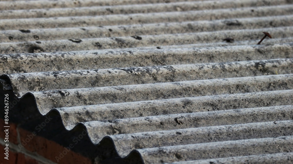 Asbestos roof tiles that have started to become ugly, originally gray ...