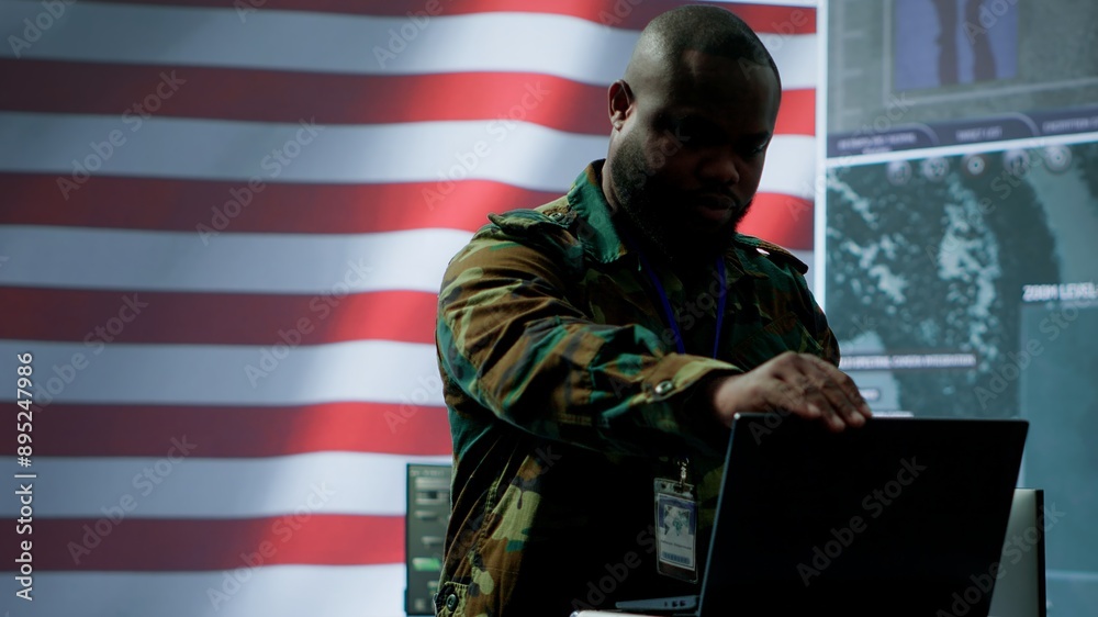 US military personnel work in a modern army command post, safeguarding ...