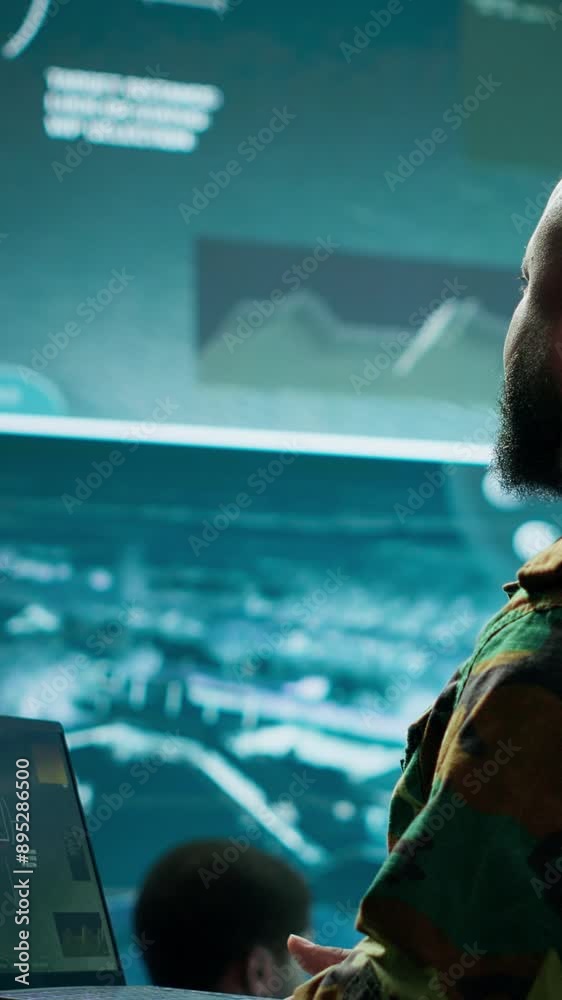Vertical Video Military officer oversees surveillance and cybersecurity ...