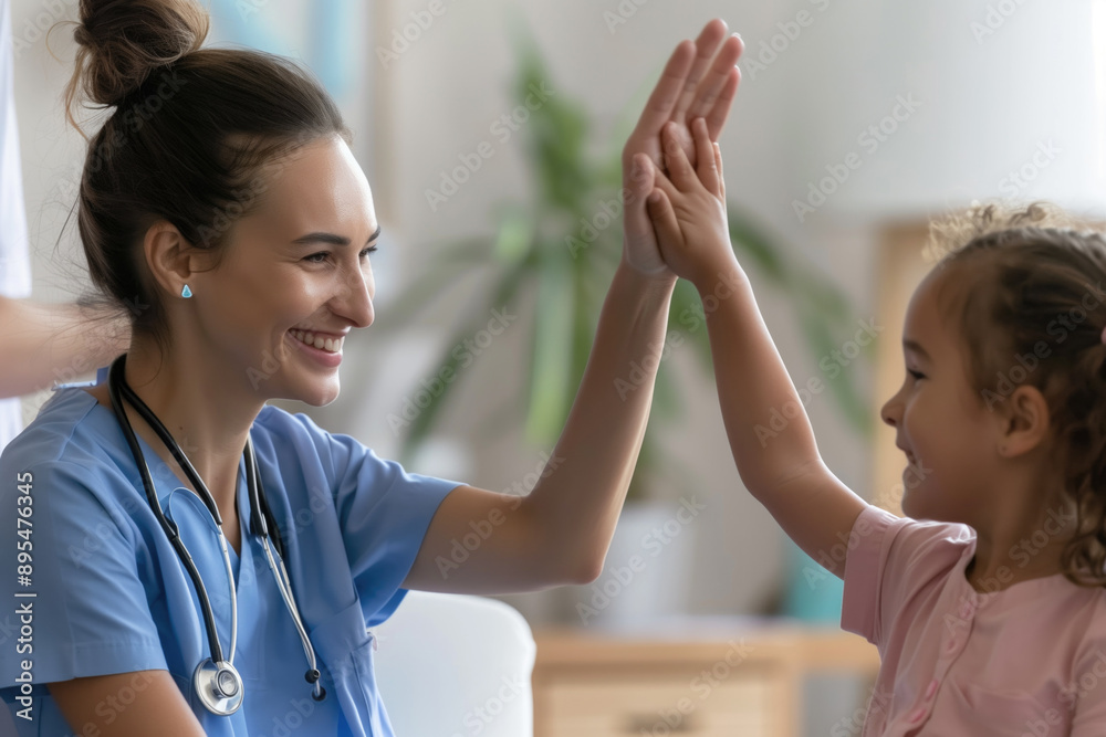 Female doctor in a blue uniform high-fiving a young girl in a cozy ...