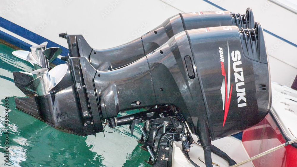 Profile of a pair of outboard marine engines model Suzuki 75 hp four ...