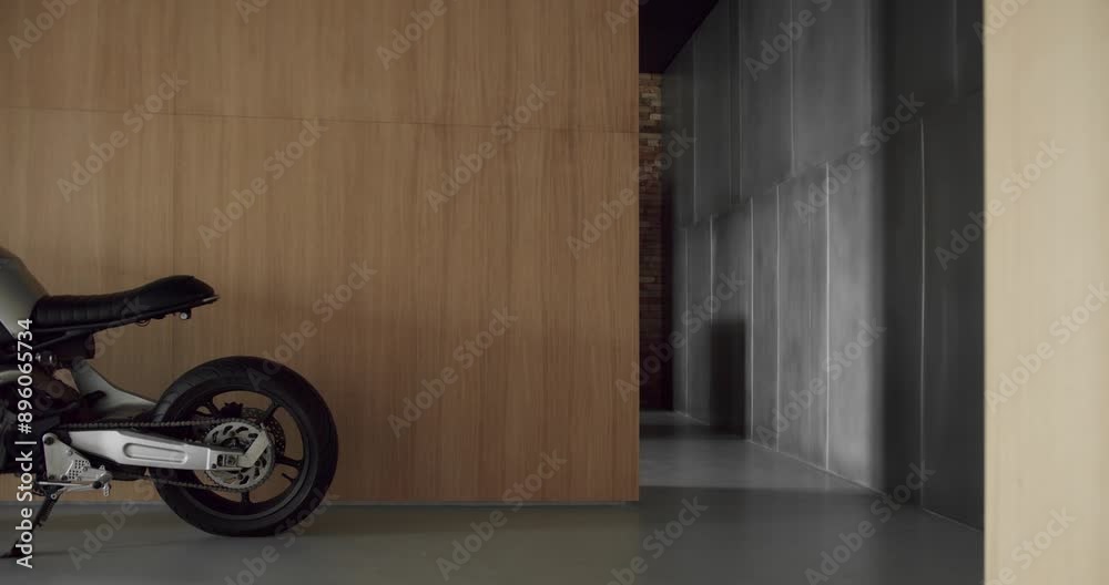 The man's shadow appears on the concrete wall in the apartment. Sports ...