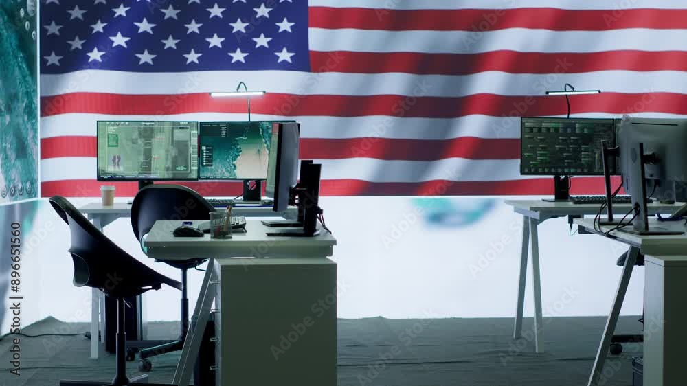 Empty military control center with a big screen shows the American flag ...