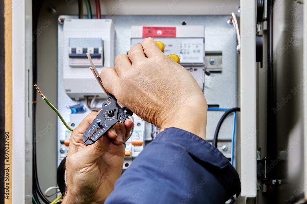 Electrical installation work on connecting power cable to an outdoor ...