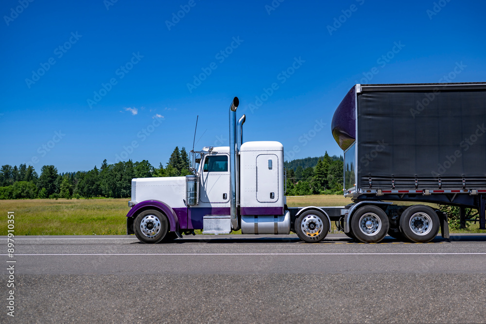 Profile of the classic white big rig semi truck with chrome exhaust ...