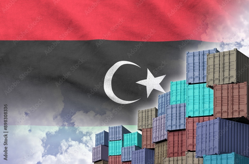 Libya flag and big stack of shipping cargo containers in docks with sky ...