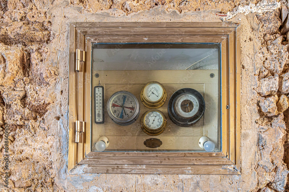 Panel with old measuring instruments located in Port Salve, an arch of ...