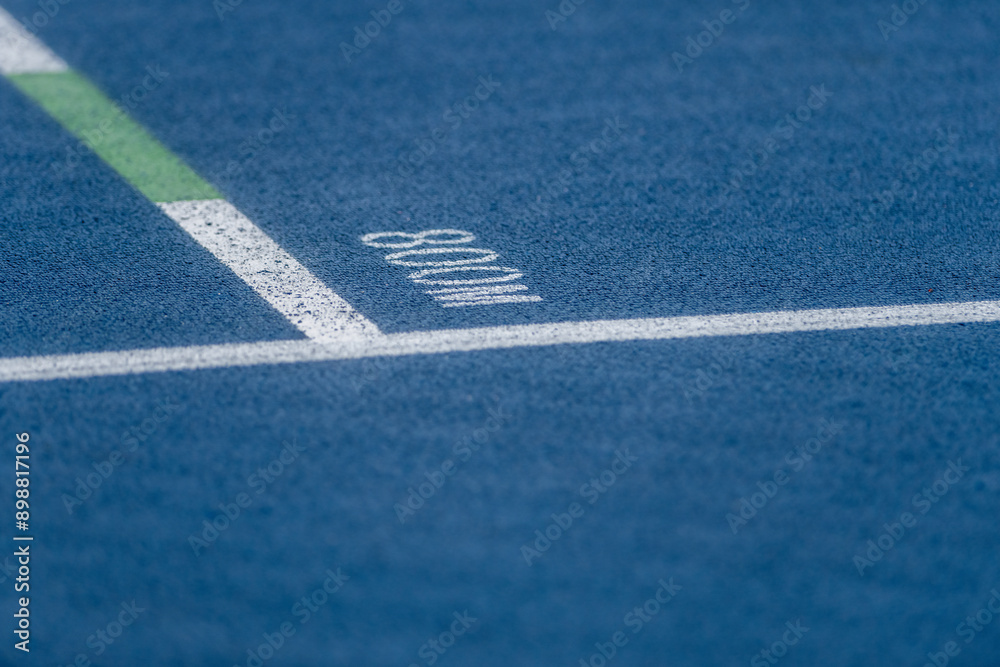 Blue track and field lane with mark 800. Running lanes at a track and ...
