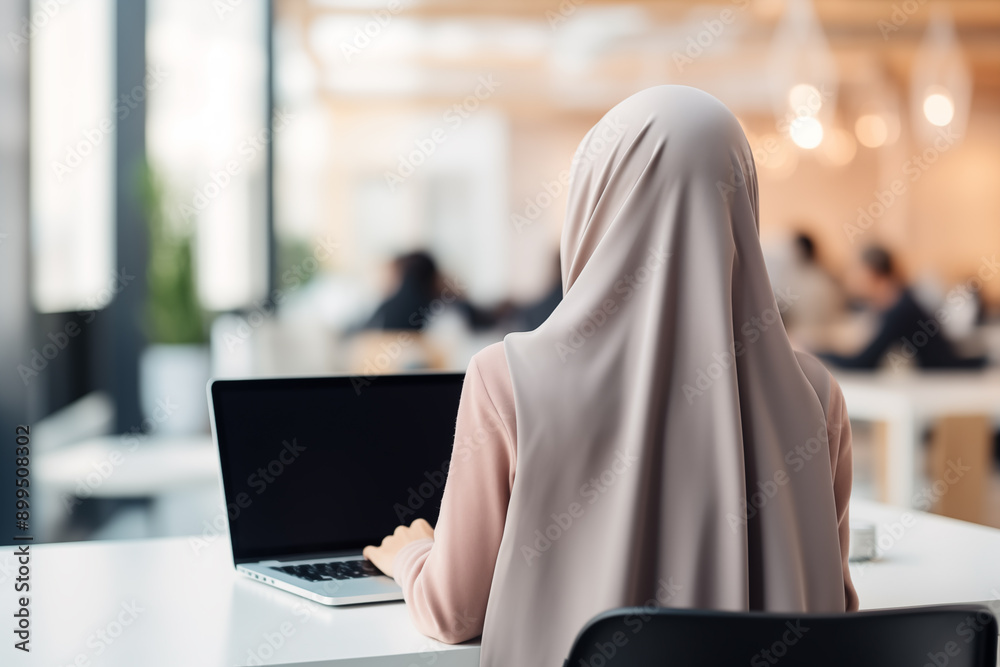 Unrecognizable arab woman in hijab using laptop blank screen in ...
