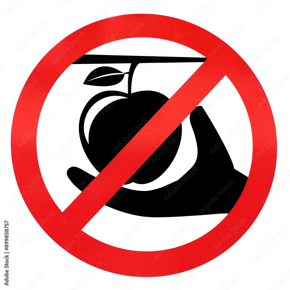 A prohibition sign with a black silhouette of a hand picking an apple ...