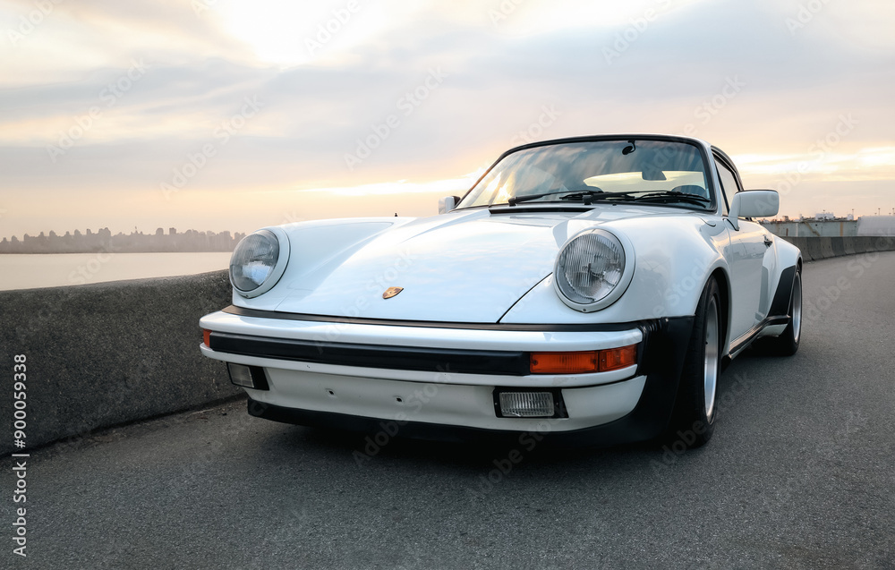 Porsche 911 SC Classic parked at waterfront with city skyline. Vintage ...