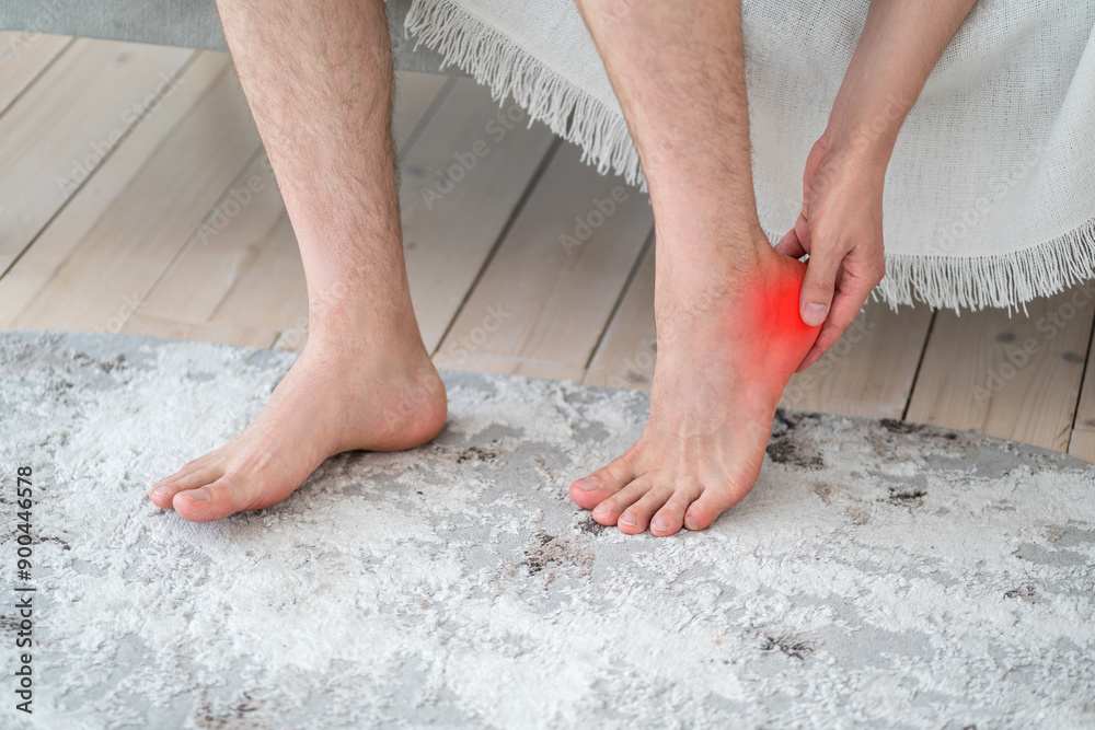 Foot pain, corns and calluses, dry skin on legs, man suffering from ...