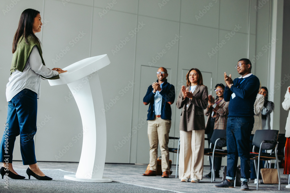 Female leader giving a business presentation at a conference event ...
