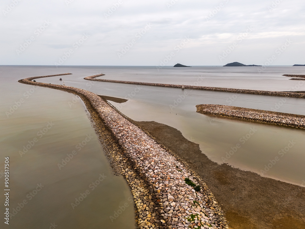 Aerial view of seawalls, breakwater coastal erosion protection ...